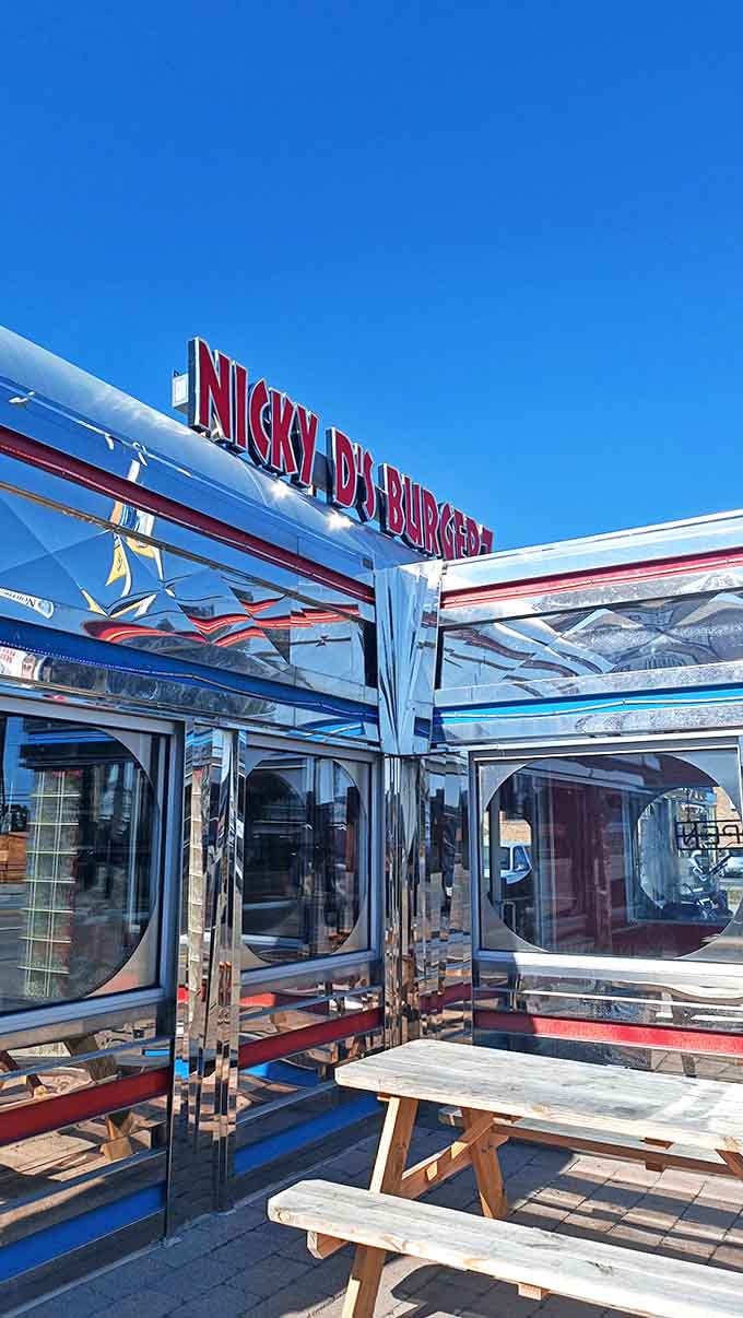 Outside: Reflective surfaces gleam under clear blue skies, making this diner shine like a chrome beacon of burger salvation on Port Huron's horizon.