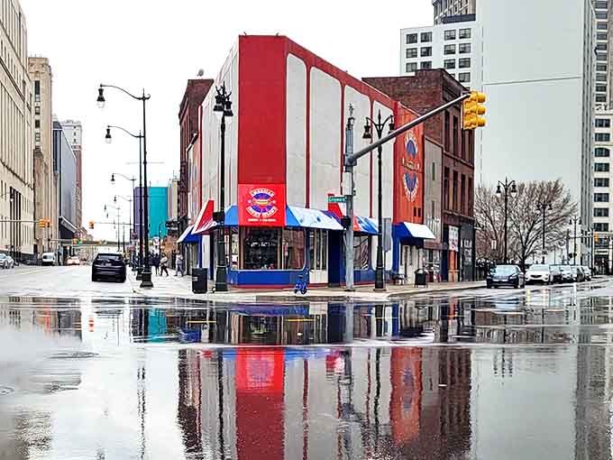 Rain or shine, the distinctive American Coney Island building stands as a colorful landmark in downtown Detroit's evolving urban landscape.