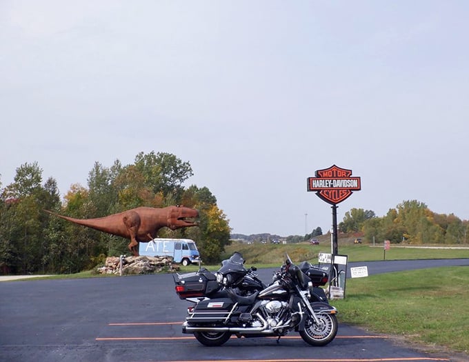 A dinosaur stands guard outside &ndash; perhaps reminding us what powers these beautiful machines from a prehistoric past.