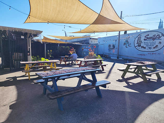 Patio Dining: Colorful picnic tables under shade sails offer a cheerful outdoor option for enjoying your carb-laden treasures.