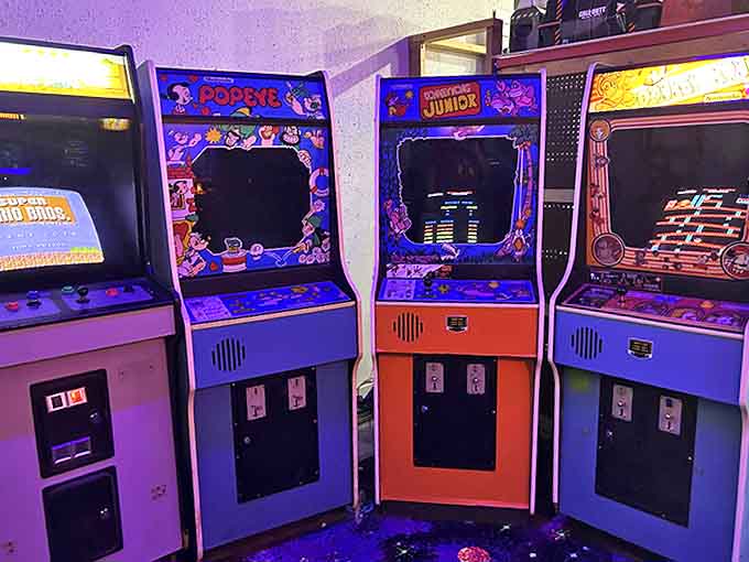 Popeye, Donkey Kong Junior, and other arcade legends stand shoulder-to-shoulder, their cabinets forming a colorful chorus of gaming history's greatest hits.
