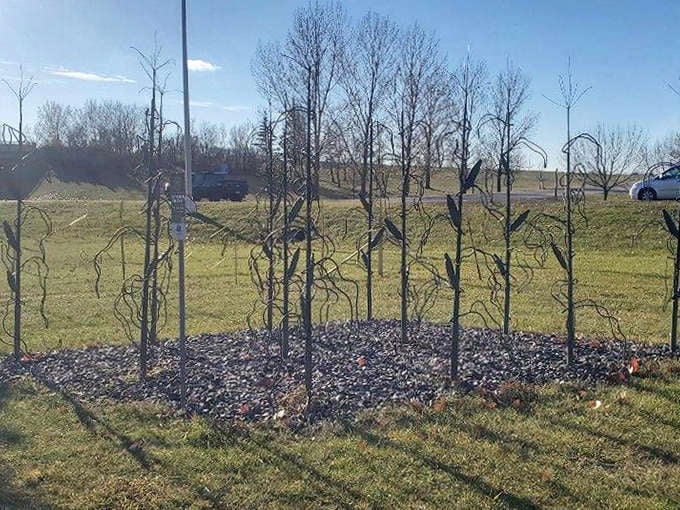 Metal trees rise from a bed of stones, their twisted forms capturing the resilience and imagination of the Minnesota spirit.