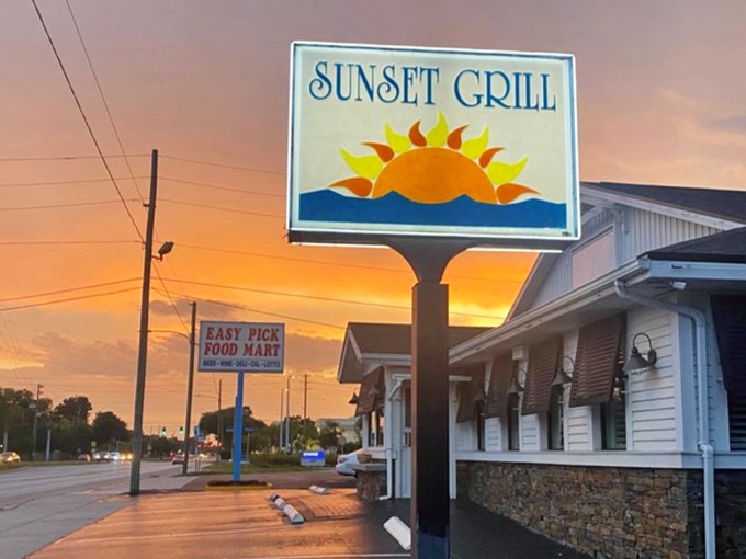 As day turns to dusk, the Sunset Grill sign lives up to its name &ndash; glowing against the twilight sky like a beacon for hungry travelers.