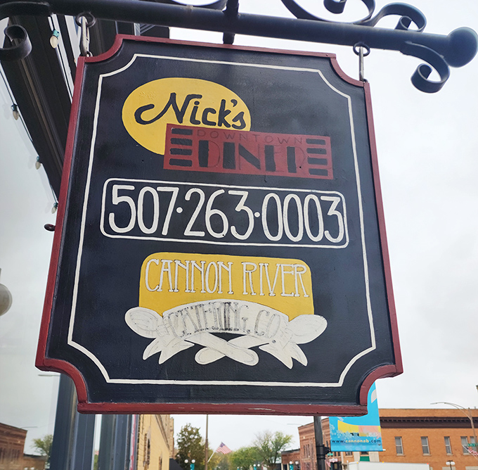 The hanging sign outside proudly announces Nick's Downtown Diner to Cannon Falls, a beacon for hungry travelers and locals alike.