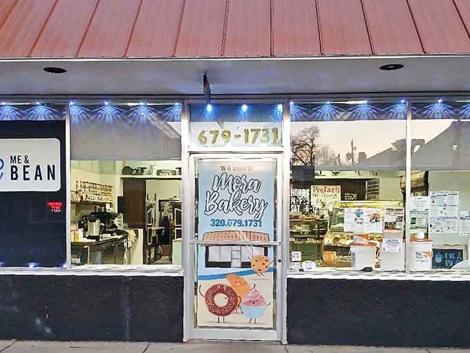 The weathered park sign stands as a humble introduction to the grandeur beyond, like a modest doorway leading to a natural cathedral.