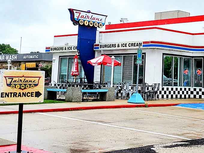 The Fairlane Diner sign isn't just signage &ndash; it's a beacon calling hungry travelers to exit the fast lane for a taste of simpler times.