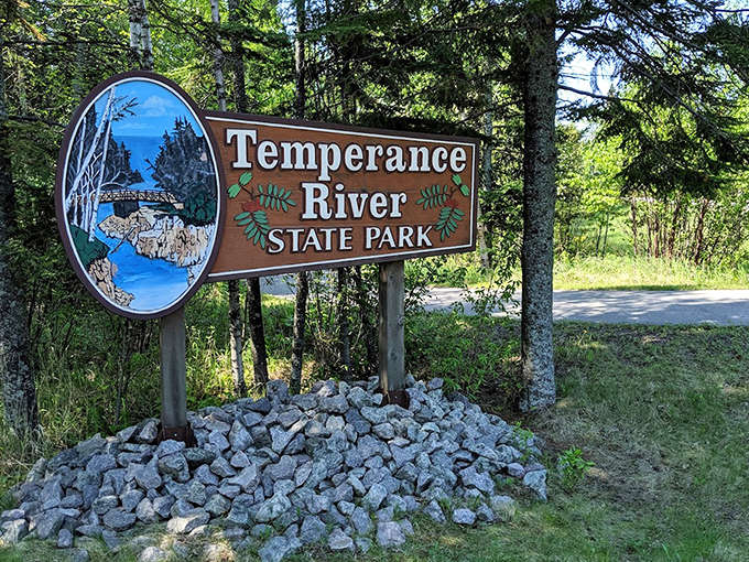 The welcoming park sign stands as a gateway to adventure, promising memories that'll last longer than your smartphone battery.