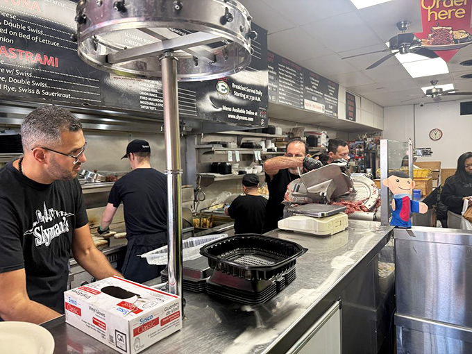 The skilled staff works with practiced precision, building sandwiches that have made Slyman's a destination for deli devotees nationwide.