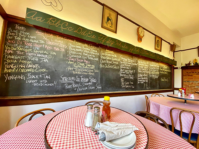 Vintage chalkboards and checkered tablecloths &ndash; where educational artifacts meet dining comfort in perfect harmony.