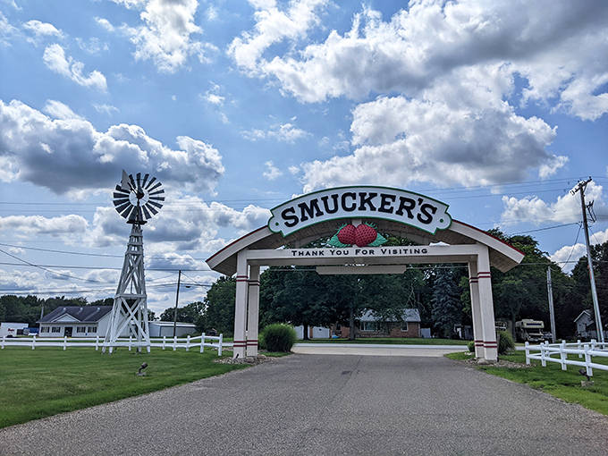 The farewell arch thanks visitors as they depart, the windmill standing sentinel as cars pull away with trunks full of spreadable treasures.
