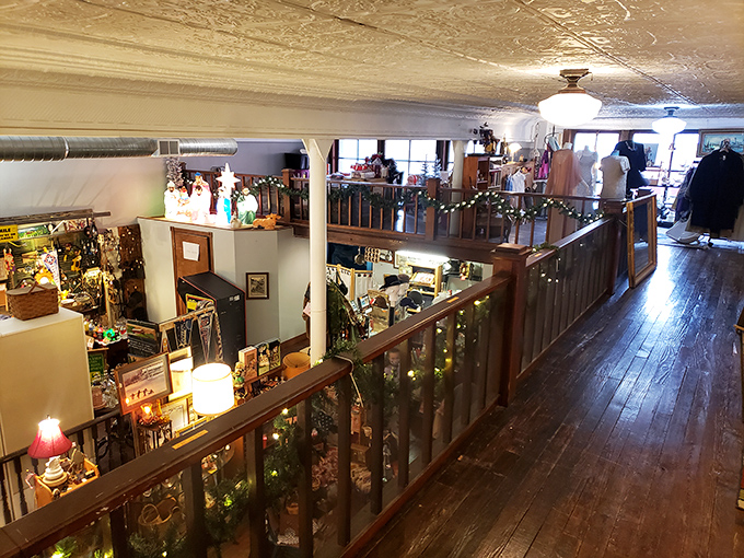 The upper level balcony offers a bird's-eye view of the main floor, revealing the impressive scale of this carefully curated wonderland.