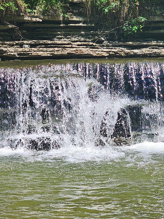 Water dances over the edge in perfect formation, creating a natural curtain that's been performing the same show for centuries.