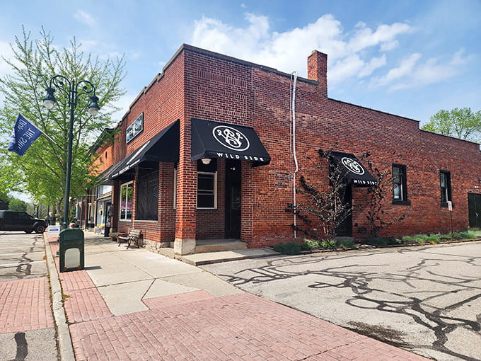 The Wild Side restaurant balances historic charm with contemporary dining &ndash; that black awning signals good things await inside those brick walls.