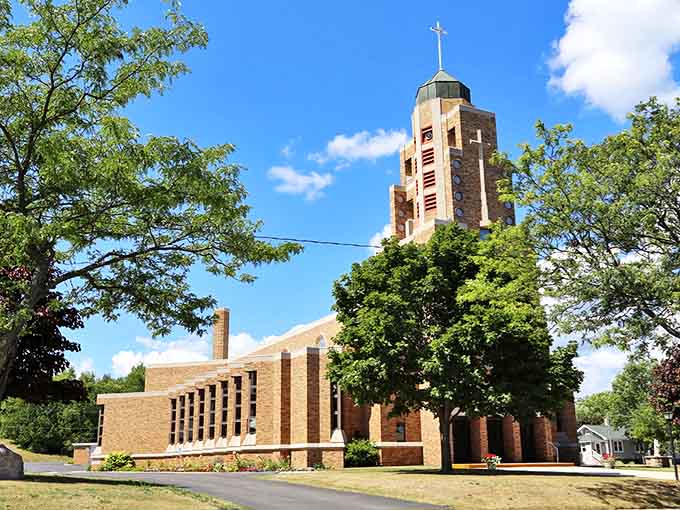 This striking brick church reaches skyward with its impressive tower, standing as both architectural landmark and spiritual center for generations.