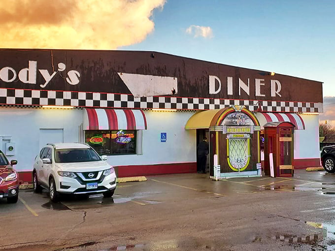 Woody's 50's Diner stands proud with its classic black and white checkered trim and vibrant red awnings, a true beacon of nostalgia in Le Roy.