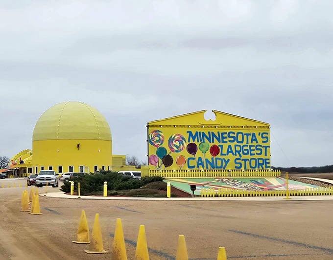 Even on cloudy days, this candy paradise glows like a giant lemon drop, with its cheerful yellow dome and vibrant signage calling to sweet-toothed travelers.