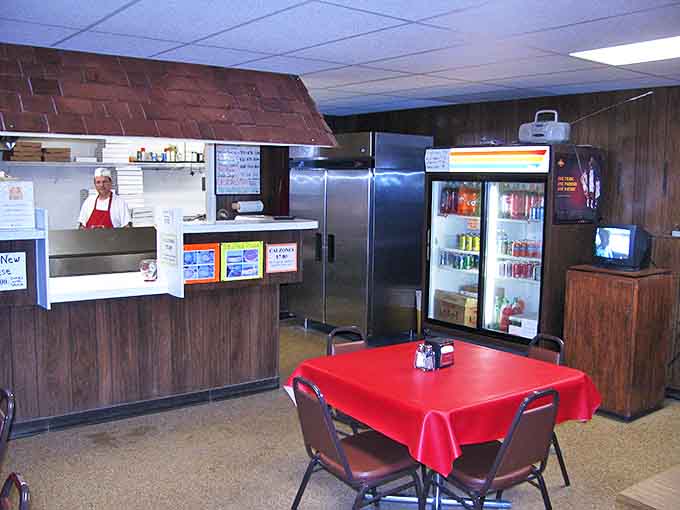 Wood paneling and no-nonsense decor create that classic pizzeria atmosphere where the focus is squarely on the food, not Instagram-worthy backdrops.