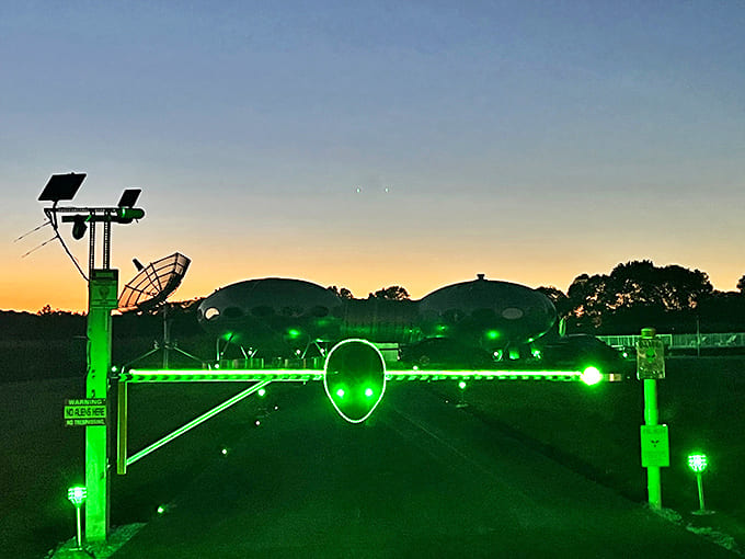 Approaching the alien gate feels like crossing a threshold between worlds, the green glow promising otherworldly wonders beyond.
