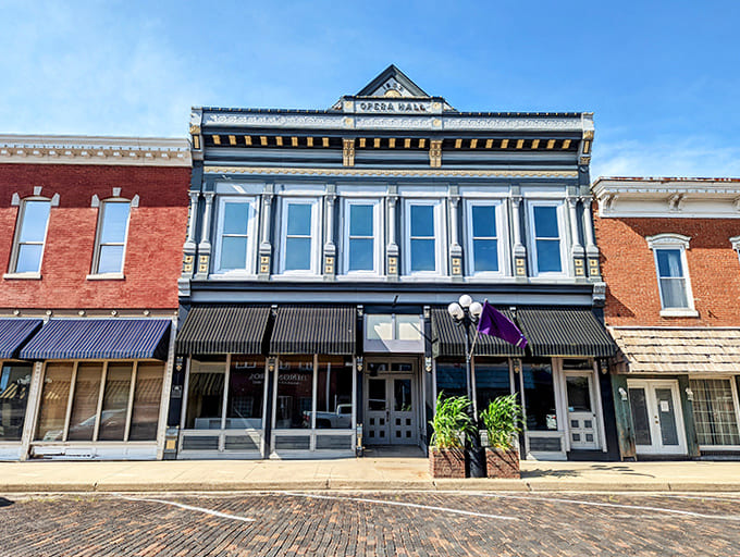 The Opera Hall Building stands proud with its classic facade, reminding everyone that culture and cornfields can absolutely coexist in perfect harmony.