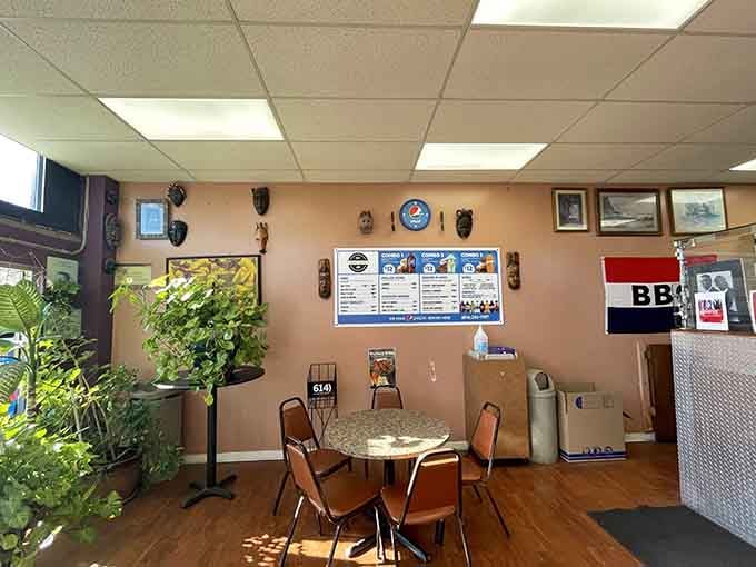 Simple tables, cultural artwork, and a Pepsi clock create the perfect no-frills atmosphere where the food does all the talking and showing off.