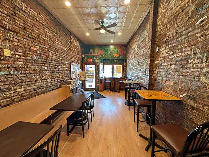 Exposed brick walls and cozy seating create an intimate atmosphere where strangers become friends over exceptional bagels.