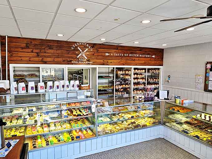 Step inside this time capsule of confectionery delight, where wooden paneling and gleaming display cases showcase decades of Dutch baking expertise.