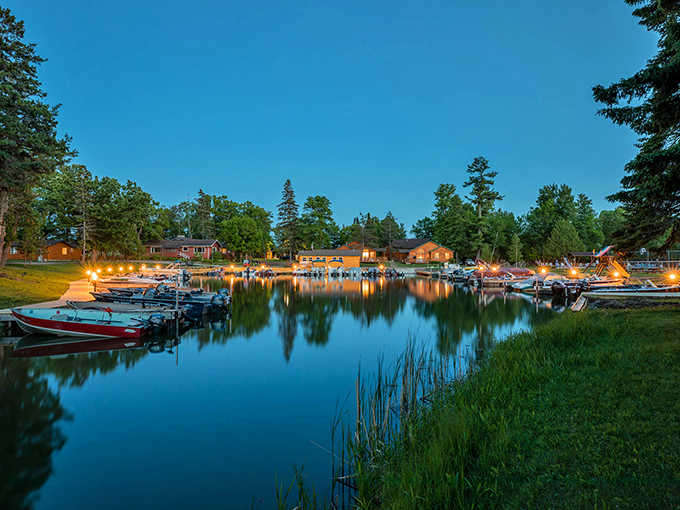 As twilight settles over Leech Lake, the marina transforms into a postcard scene where boats rest after a day of adventure.