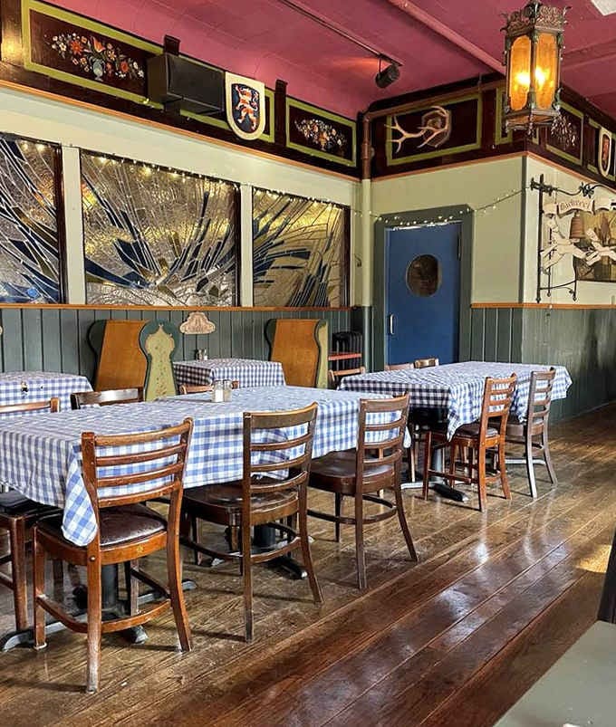 Blue-checkered tablecloths and warm wood paneling create that unmistakable German gem&uuml;tlichkeit &ndash; coziness you can practically taste before your food arrives.