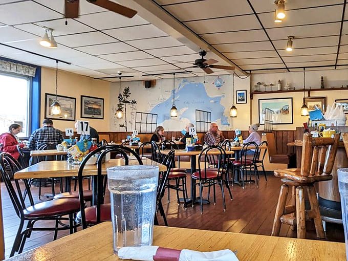 Warm wooden tables and artful wall displays create the perfect backdrop for morning conversations or solo contemplation with your coffee companion.