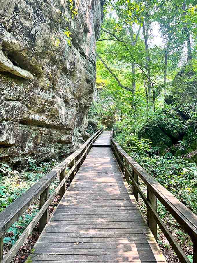 Nature's hallway beckons with a wooden boardwalk threading between towering sandstone cliffs &ndash; no architect could design a grander entrance.