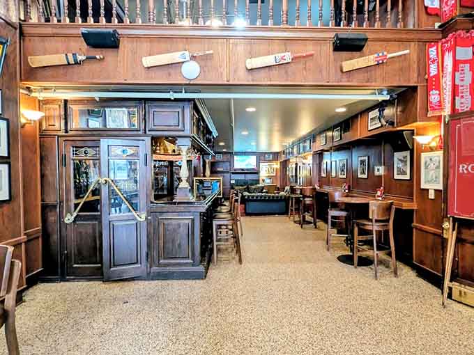 Dark wood and cozy booths create the perfect British pub atmosphere without requiring an overseas flight or dealing with jet lag.