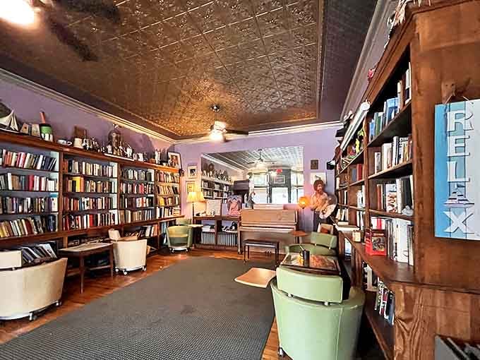 Floor-to-ceiling bookshelves meet tin ceilings in a mashup that would make Belle from Beauty and the Beast seriously jealous of this reading paradise.