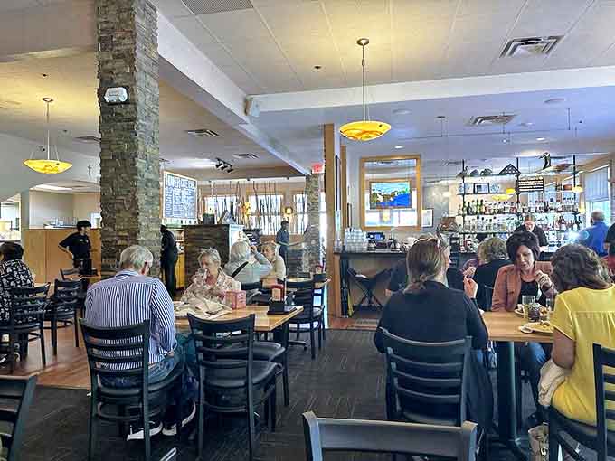 Inside, warm lighting and stone columns create a cozy atmosphere where locals and Mayo Clinic visitors gather for comfort food and conversation.