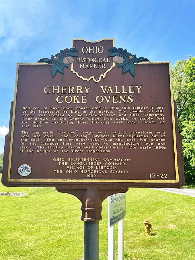 The historical marker stands sentinel, telling tales of 1866 innovation when the Leetonia Iron and Coal Company fueled America's steel revolution.