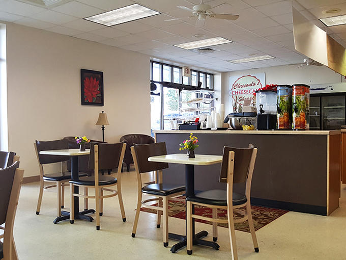Simple tables and chairs create a no-frills interior where the focus stays exactly where it should &ndash; on the heavenly cheesecakes awaiting your selection.