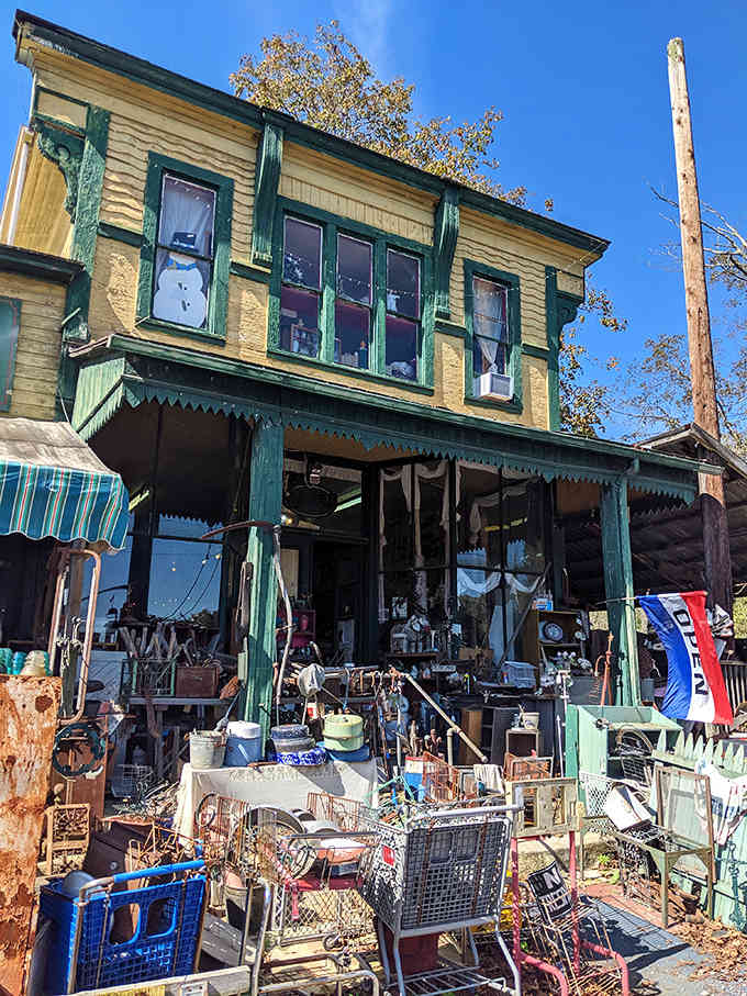 Sunlight plays across the vintage storefront, highlighting decades of character in every weathered board and window pane of this time-traveling emporium.