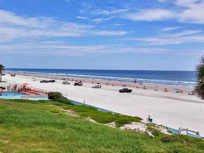 Miles of hard-packed sand where racing legends once competed now invite families, sunbathers, and yes, even cars in designated areas.