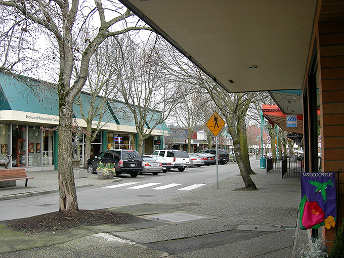 Downtown Kirkland's tree-lined streets offer shade and character, where shopping isn't a rush but a pleasant social occasion.