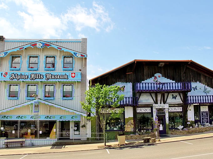 The Alpine Hills Museum stands proudly next to a butterfly-adorned shop, showcasing Sugarcreek's unique blend of Swiss heritage and artistic charm.