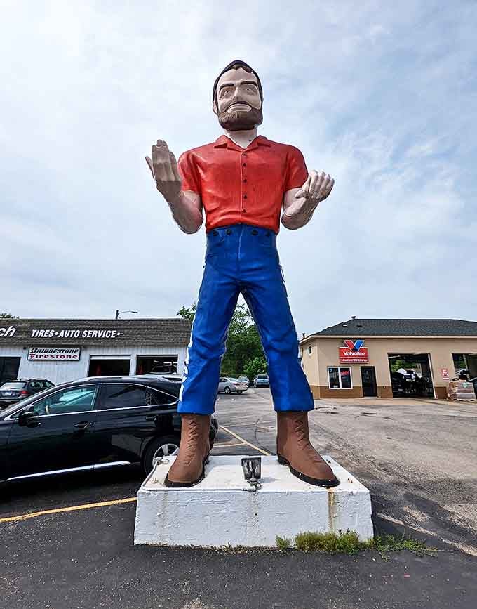 Face-to-face with fiberglass fame! This front view showcases the Muffler Man's stoic expression and classic red-shirt-blue-pants uniform.