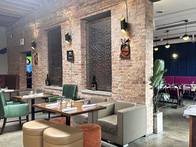 Exposed brick meets island vibes in an interior that somehow makes you forget you're in the Midwest entirely.