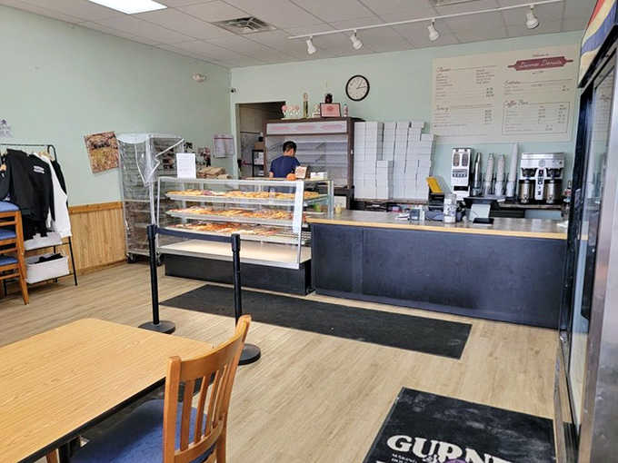 Step inside where fluorescent lights illuminate rows of sugary possibilities, and that display case holds more temptation than a dessert menu at a five-star restaurant.