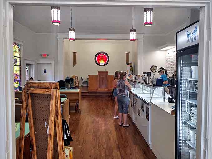 Where prayers once echoed, ice cream now reigns supreme. The former sanctuary's wooden floors and stained glass windows create an atmosphere of sweet reverence.