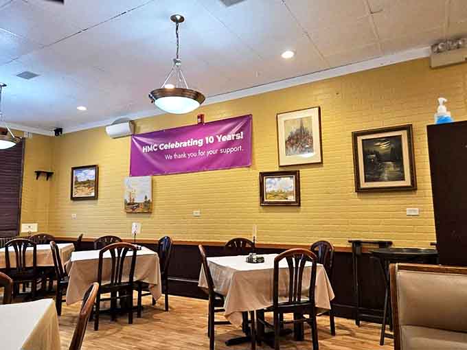 Yellow brick walls and white tablecloths create an atmosphere that's both casual and special, with a decade of memories celebrated overhead.