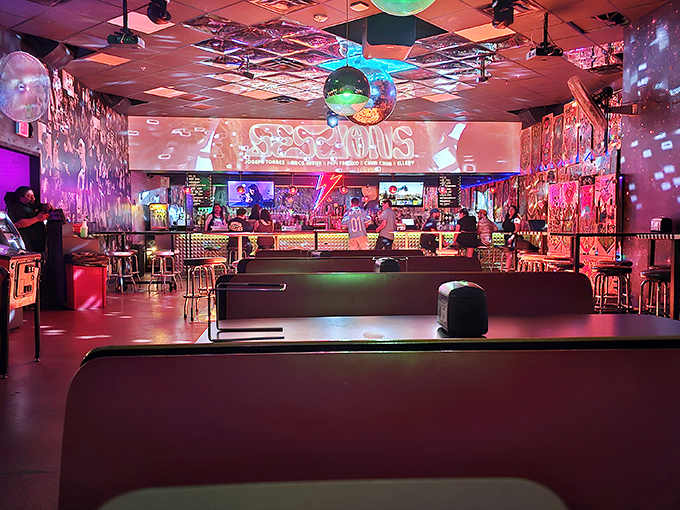 Step inside Stardust Pinbar and enter a neon dreamscape where disco balls cast kaleidoscopic patterns across players locked in flipper-flipping concentration.