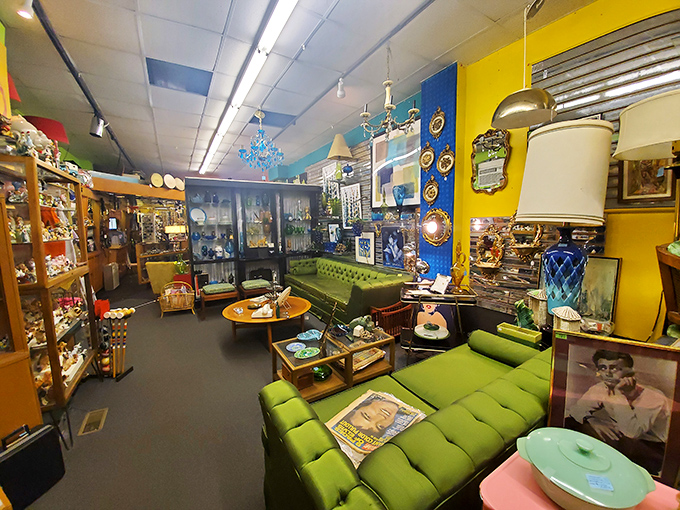 Mid-century modern meets funky retro in this living room time capsule. That green sectional has definitely heard some fascinating conversations.