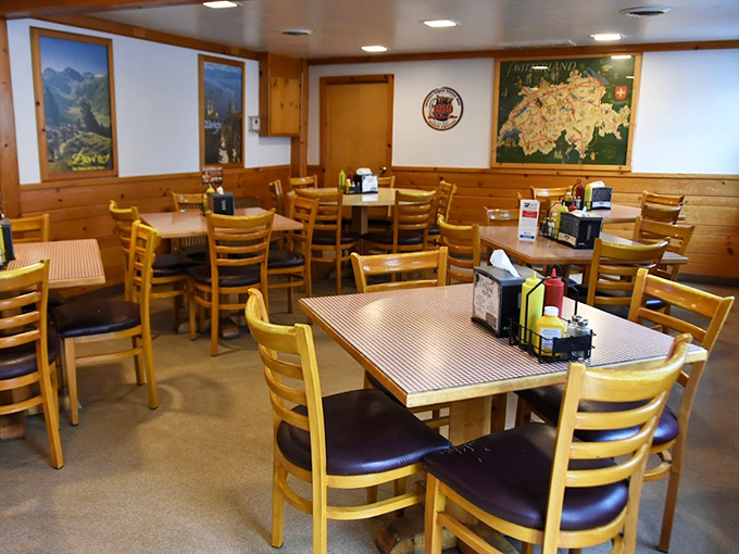 Step inside to discover a cozy dining room where wood paneling and Alpine artwork transport you to a Swiss chalet.