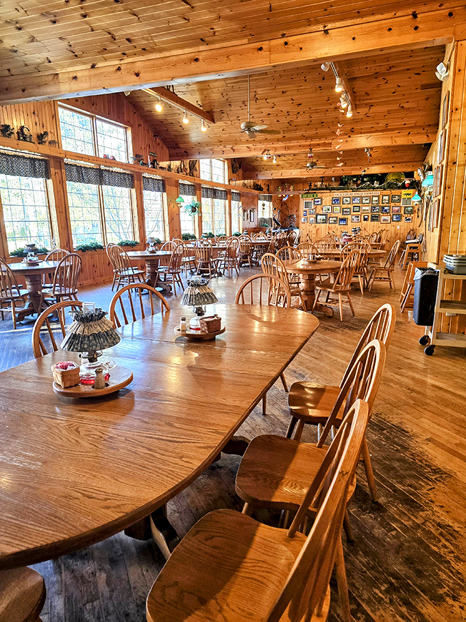 Sunlight streams through windows onto honey-colored pine tables where memories are made between bites of homestyle cooking in this warm, welcoming dining room.