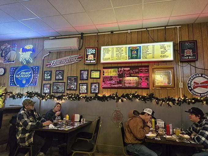 Wood-paneled walls adorned with beer signs and sports memorabilia create the perfect backdrop for conversations that flow as easily as the cold drinks.