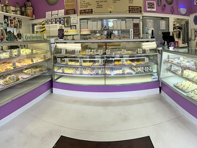 Purple-trimmed display cases showcase a treasure trove of temptations, where generations of bakers have arranged their edible masterpieces with loving precision.